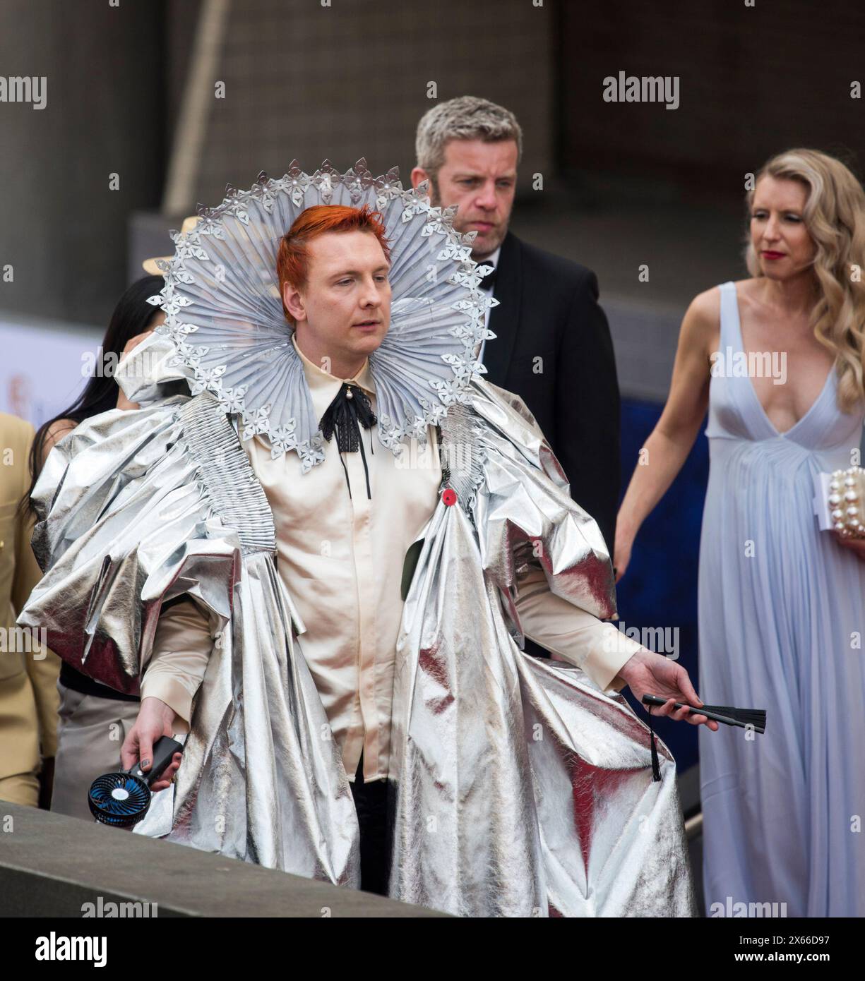 London, UK. 12th May 2024 Joe Lycett, comedian, wearing a mock ...