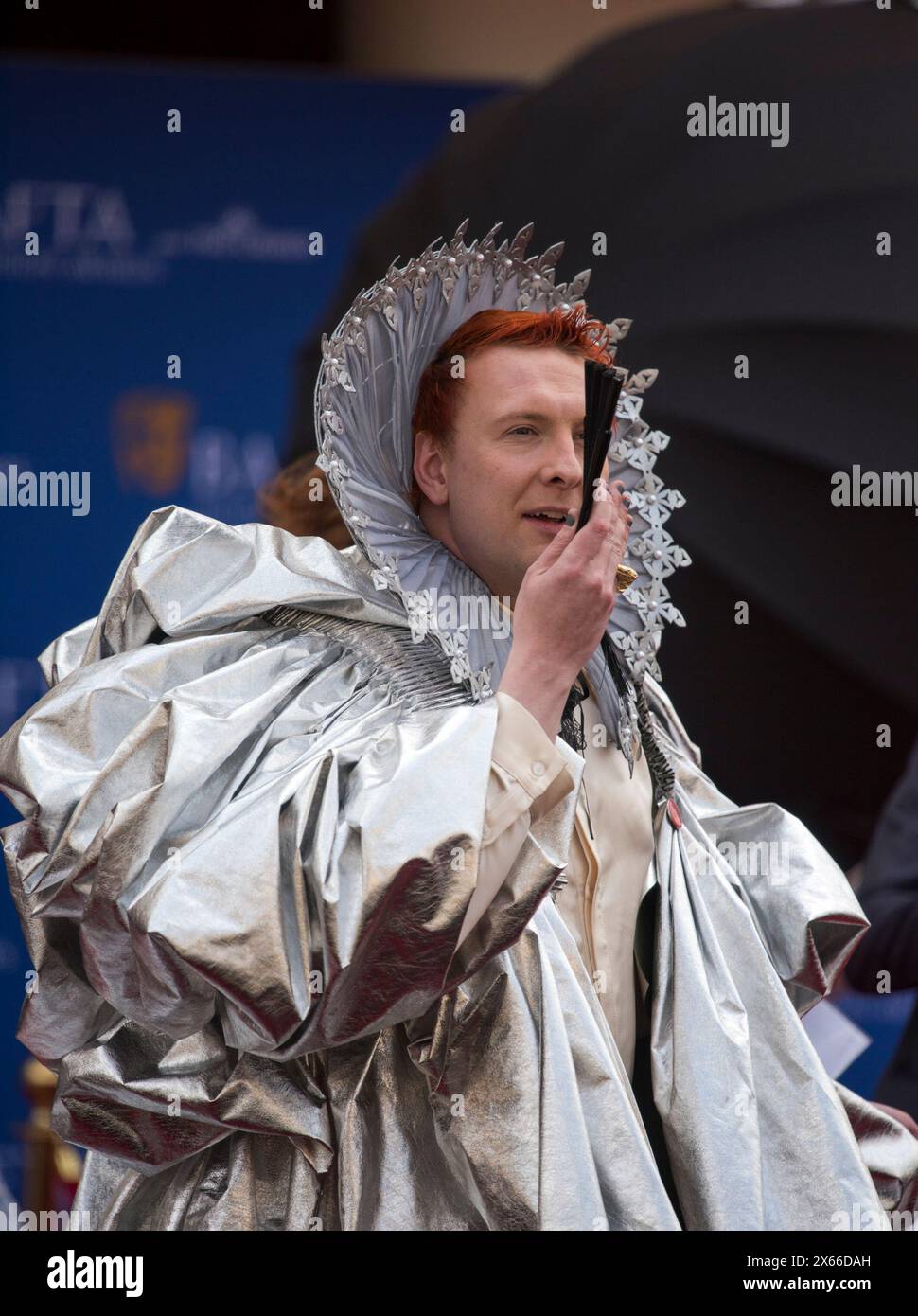 London, UK. 12th May 2024 Joe Lycett, comedian, wearing a mock ...