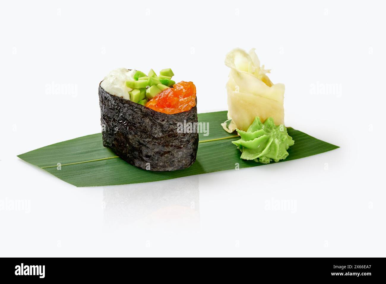 Gunkan maki sushi with salmon and avocado on bamboo leaf Stock Photo - Alamy