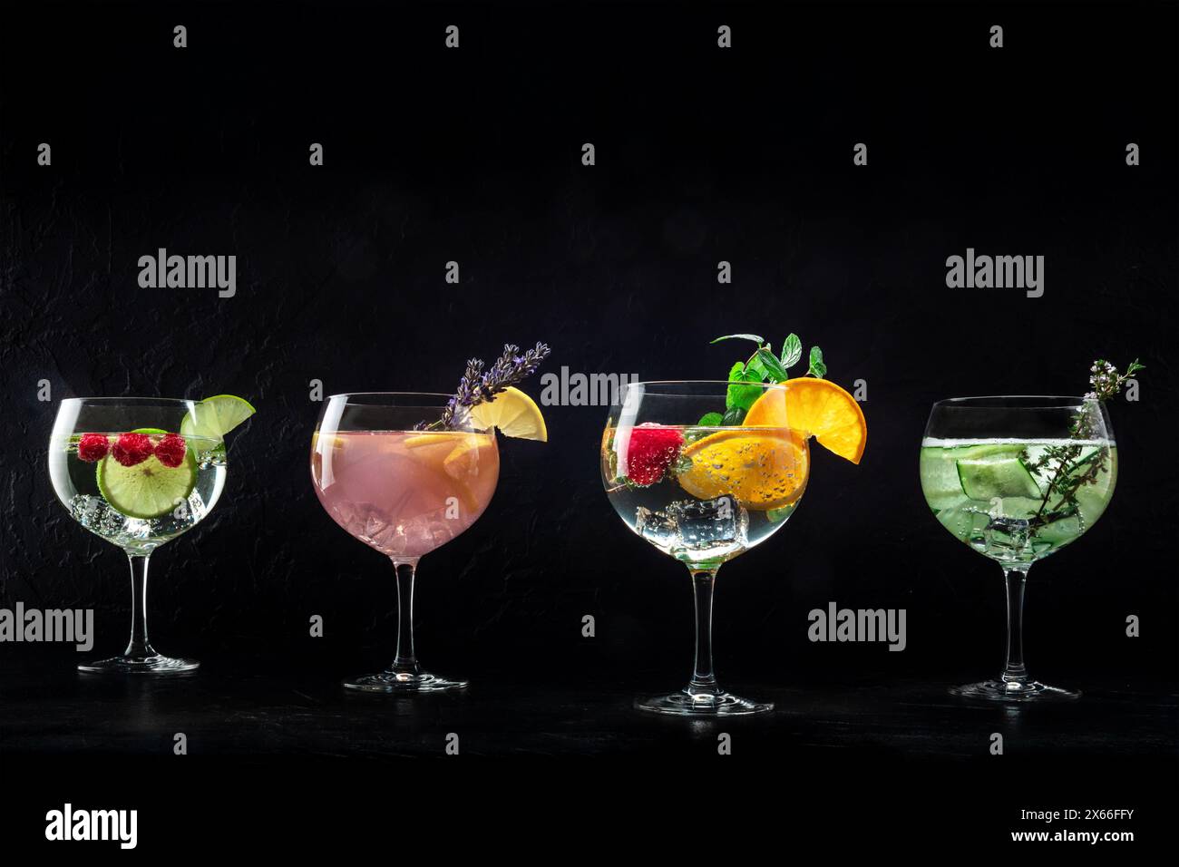 Fancy cocktails with fresh fruit. Gin and tonic drinks with ice at a ...