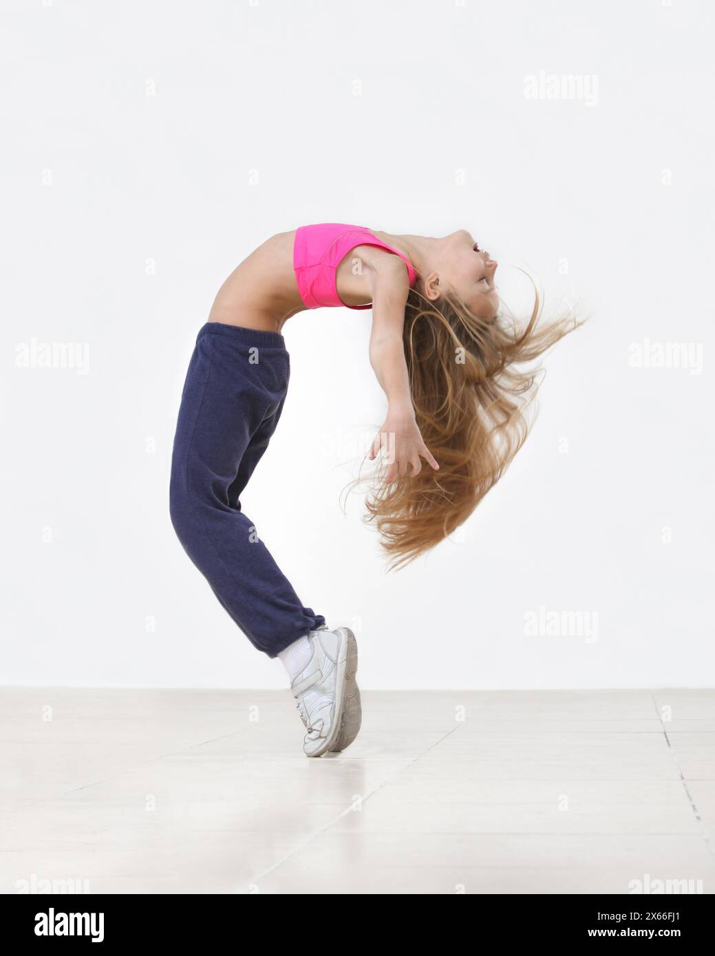 little cheerful hip hop girl in studio Stock Photo - Alamy