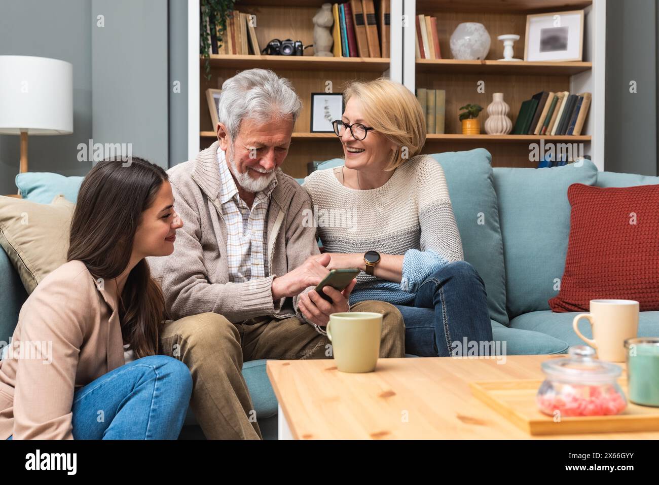 Simple living. Daughter visited her senior parents at home, looking at ...