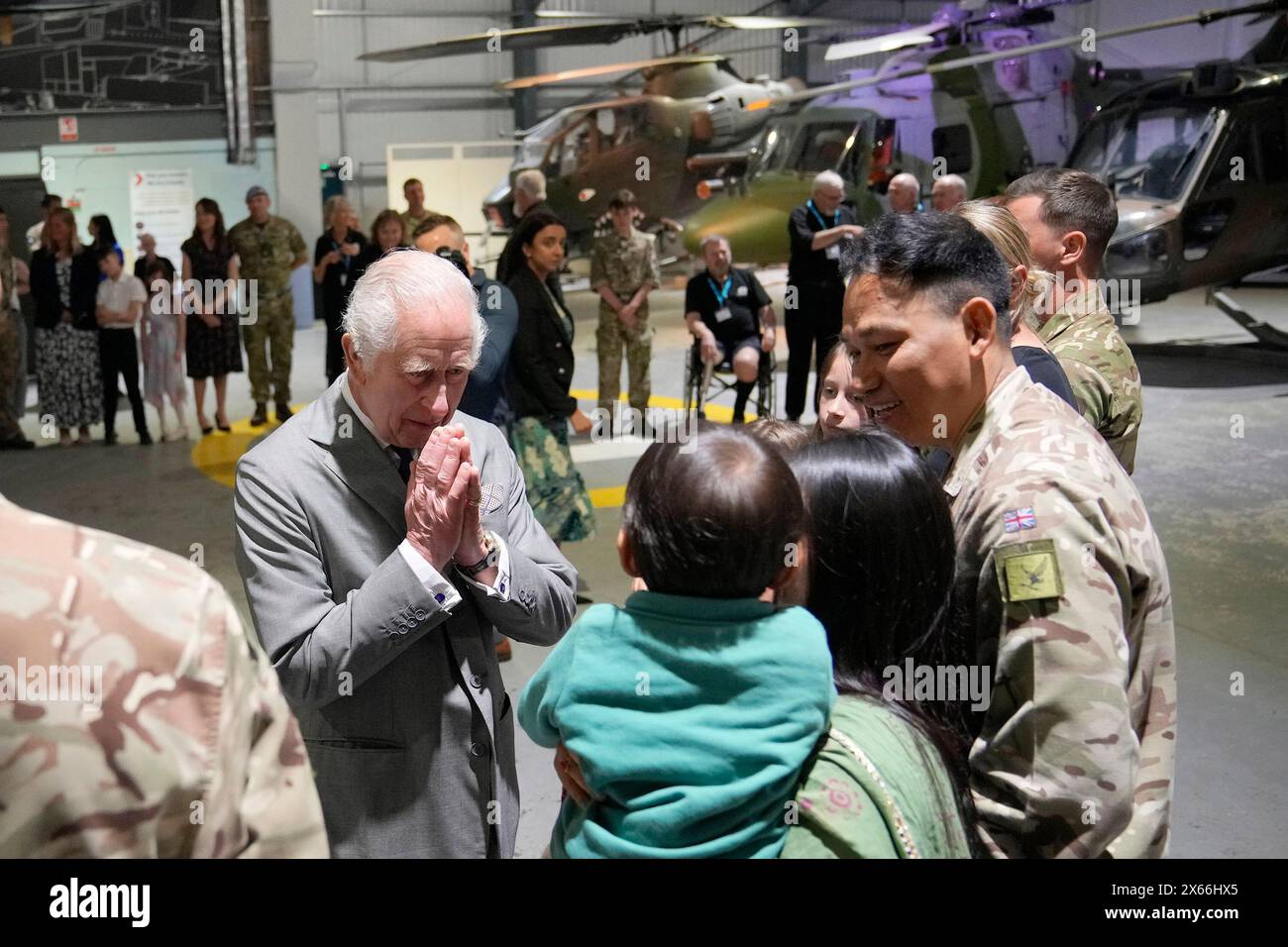 King Charles III meets staff members and their families, during a visit ...
