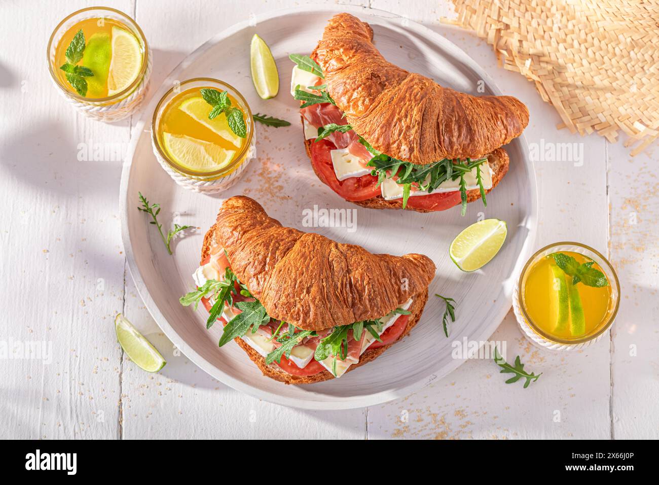 Fresh and homemade french croissant with camembert, prosciutto and ...