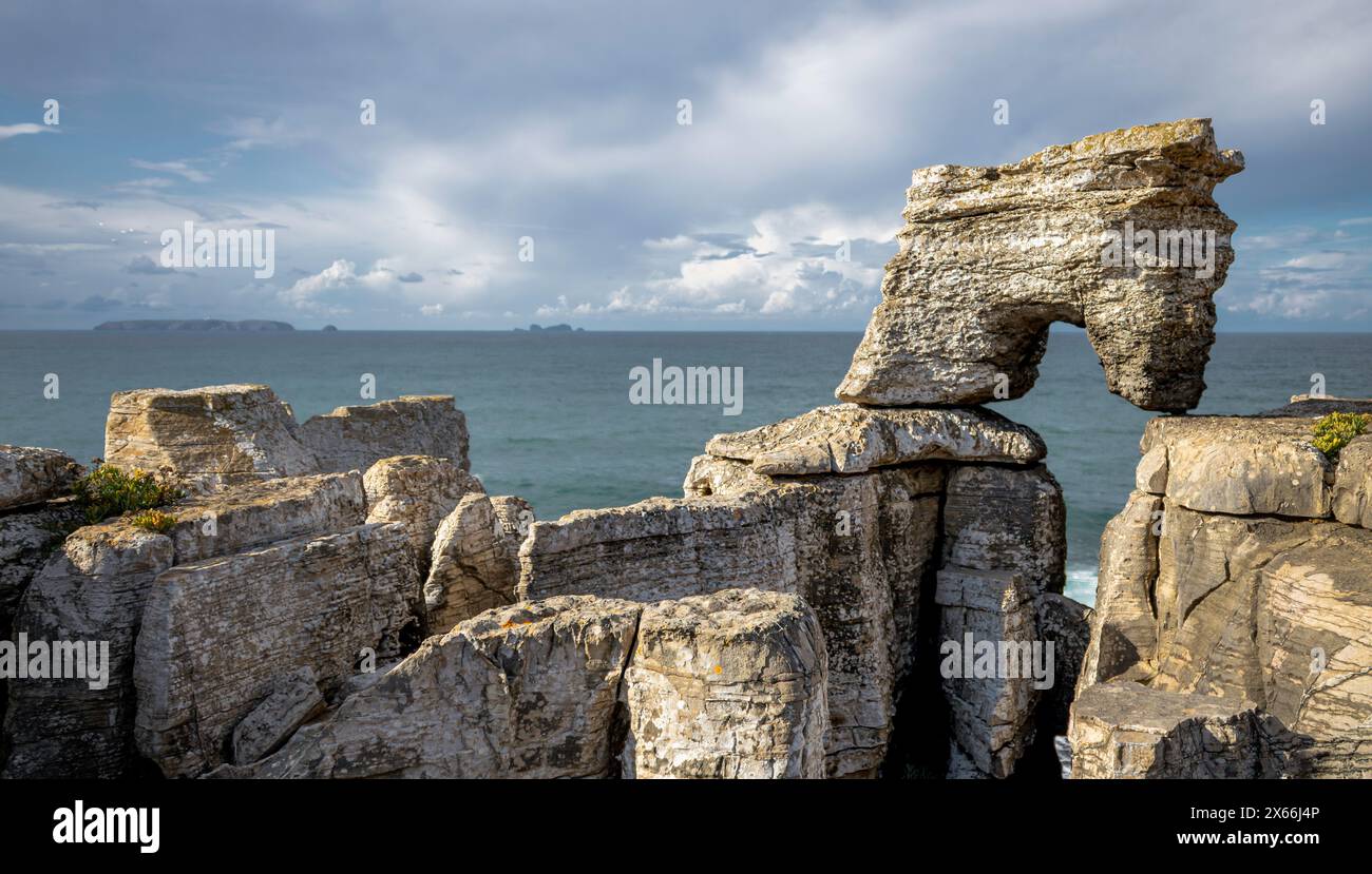 Natural rock formations at Peniche, with the Berlengas Islands, visible ...
