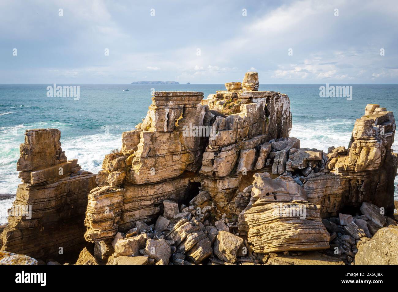 Natural rock formations at Peniche, with the Berlengas Islands, visible ...