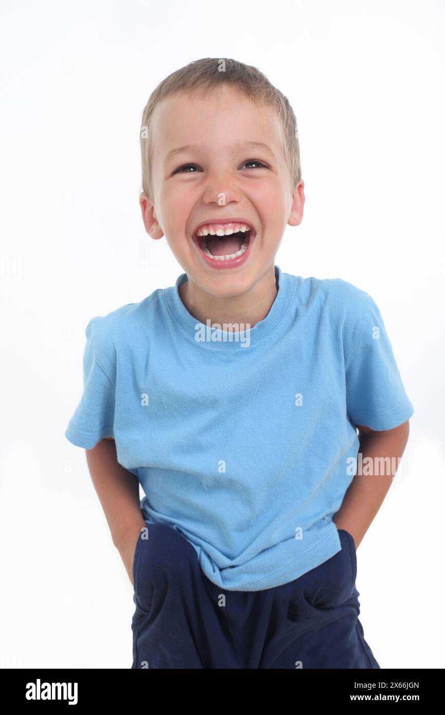 portrait of cheerful little boy on white background in studio Stock ...