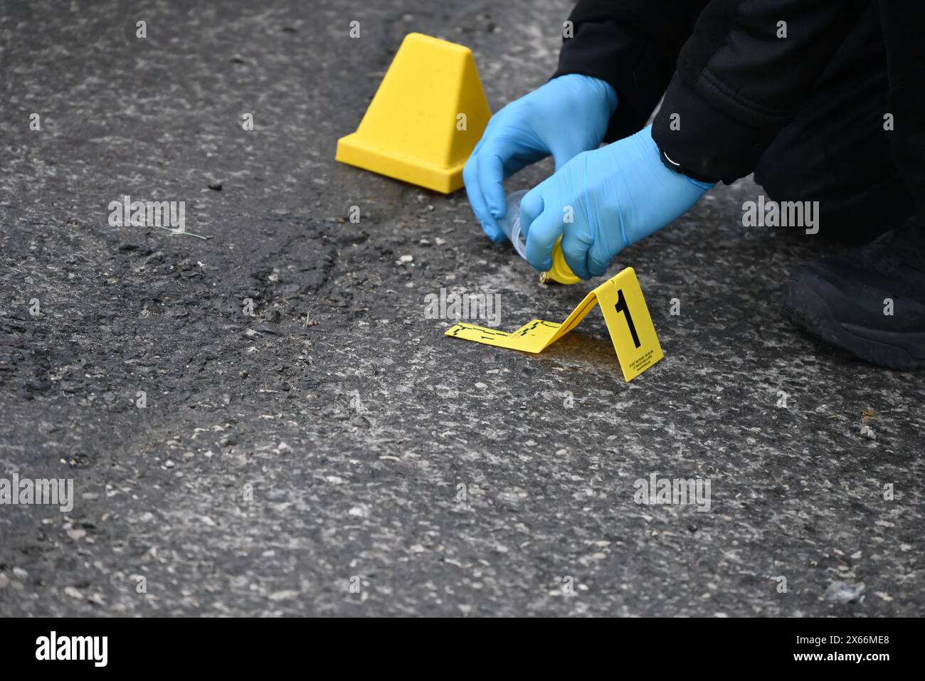 Evidence markers placed at the crime scene where clothes, shoes, shell ...