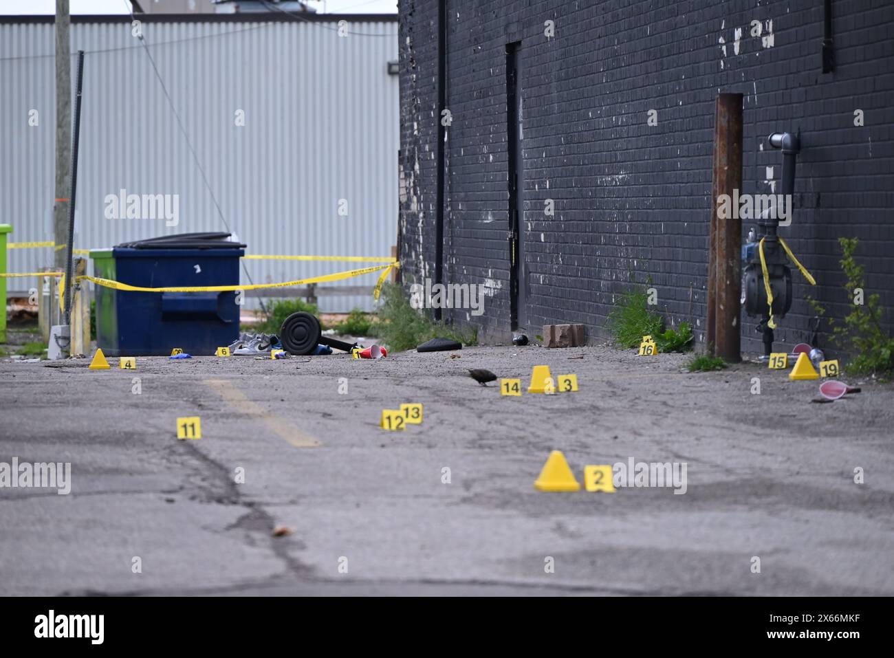 Evidence markers placed at the crime scene where clothes, shoes, shell ...