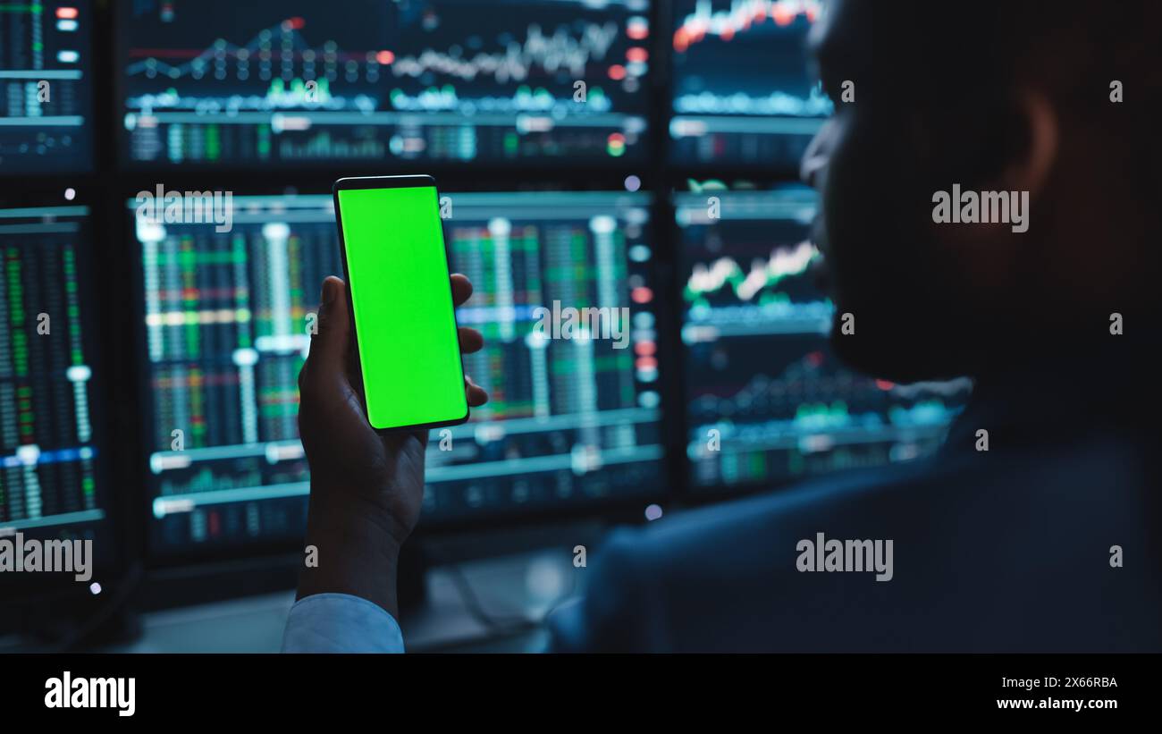 Financial Analyst Using Smartphone with Green Screen Chroma Key Mock Up ...