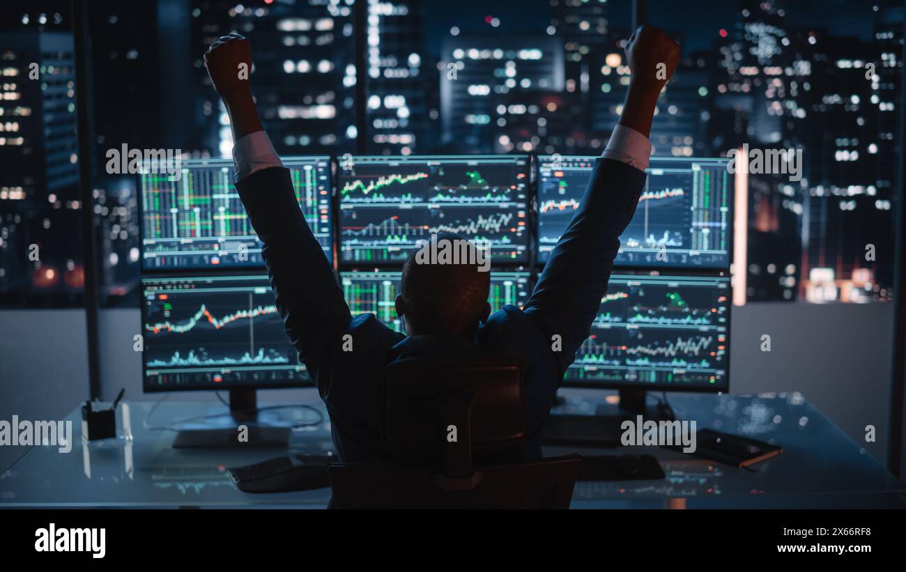 Stock Market Broker Working on a Computer with Multi-Monitor ...