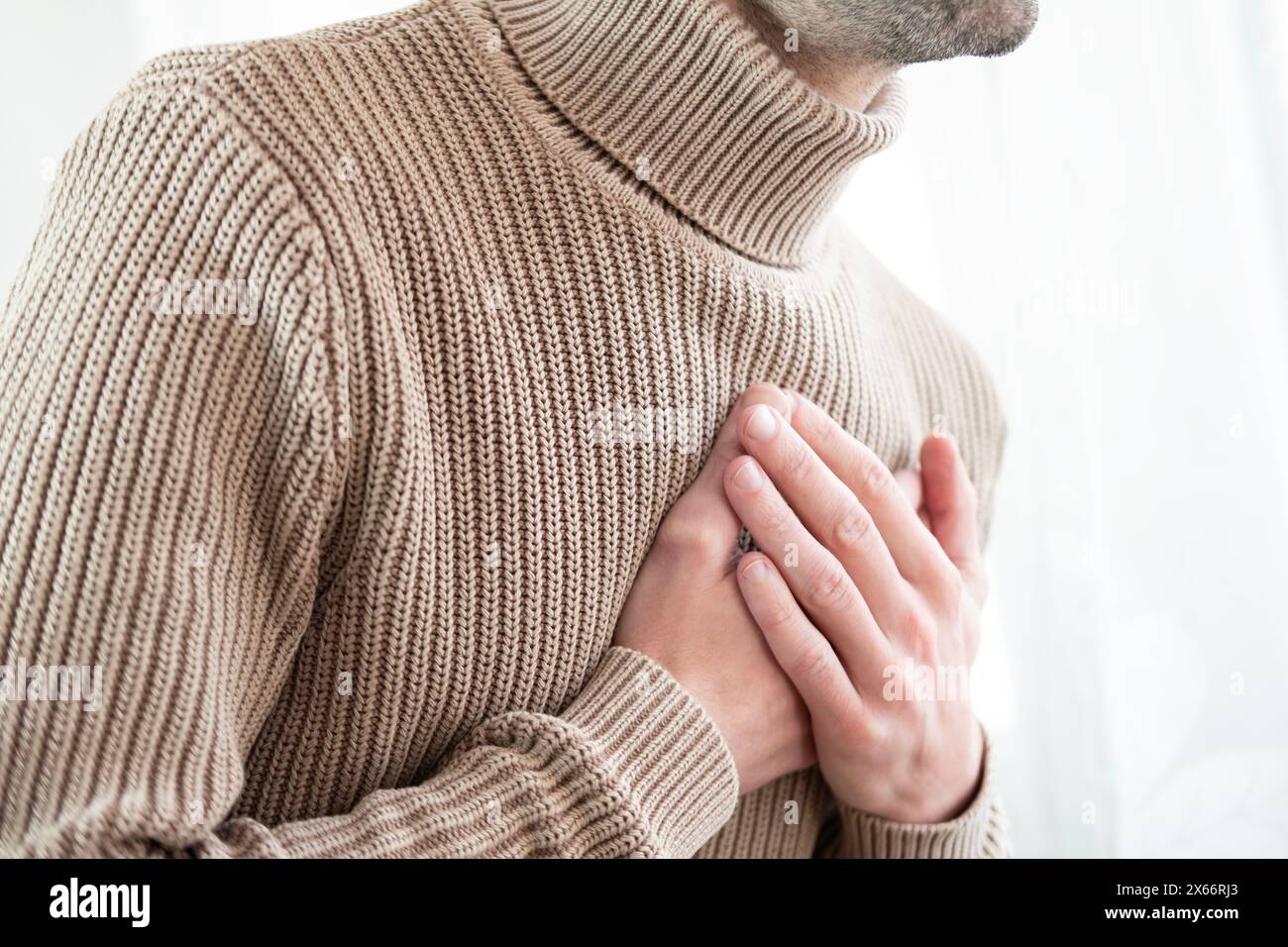 young man experiences experiences sudden chest pain behind sternum ...