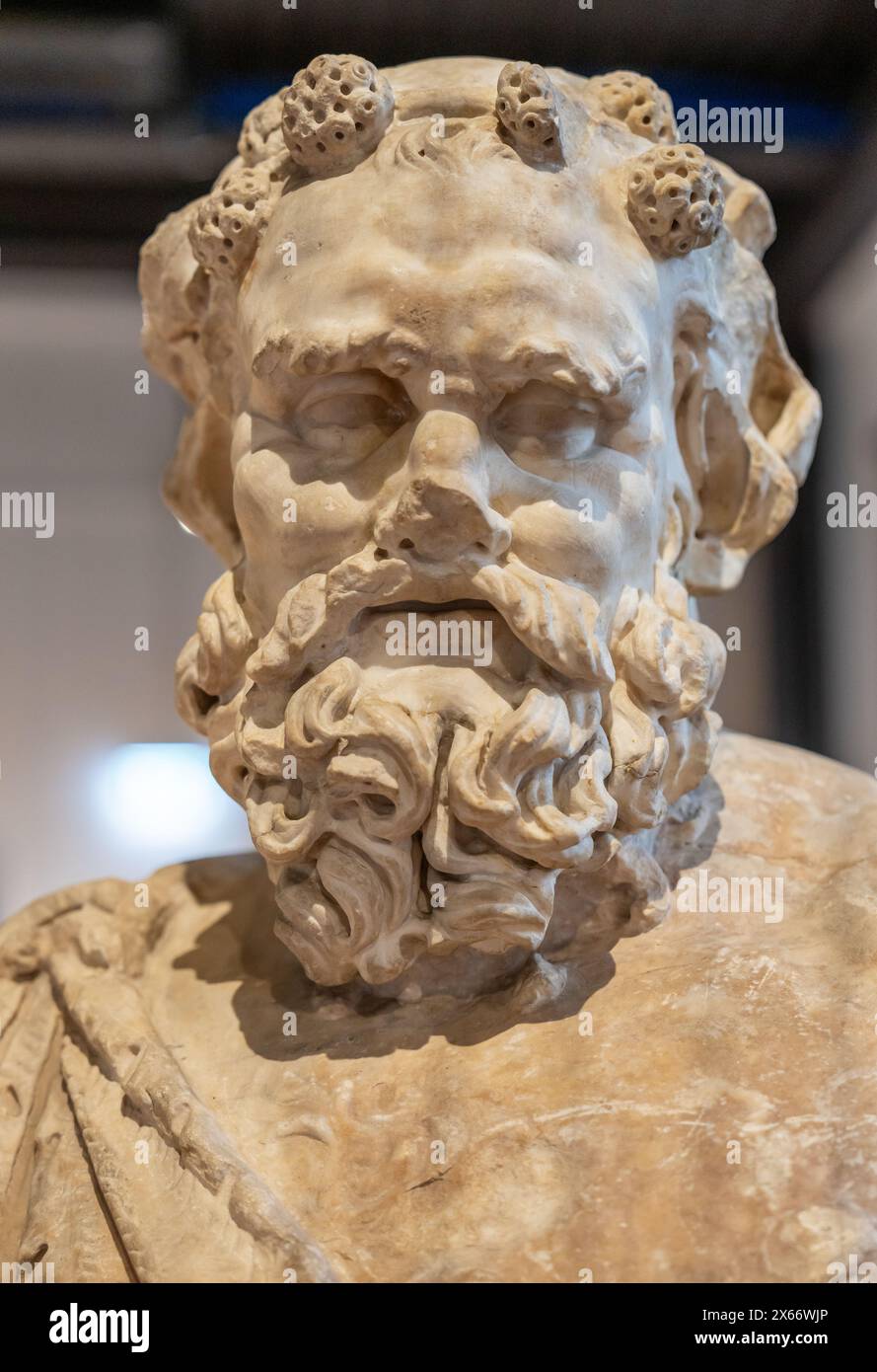 Close-up on face of ancient roman marble statue of senior man witth ...