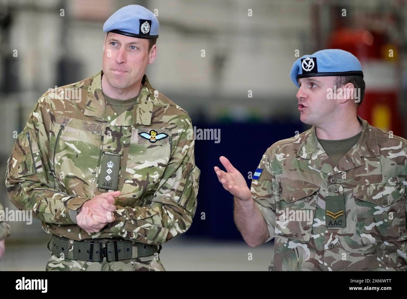 The Prince of Wales (left) speaks with service personnel at the Army ...