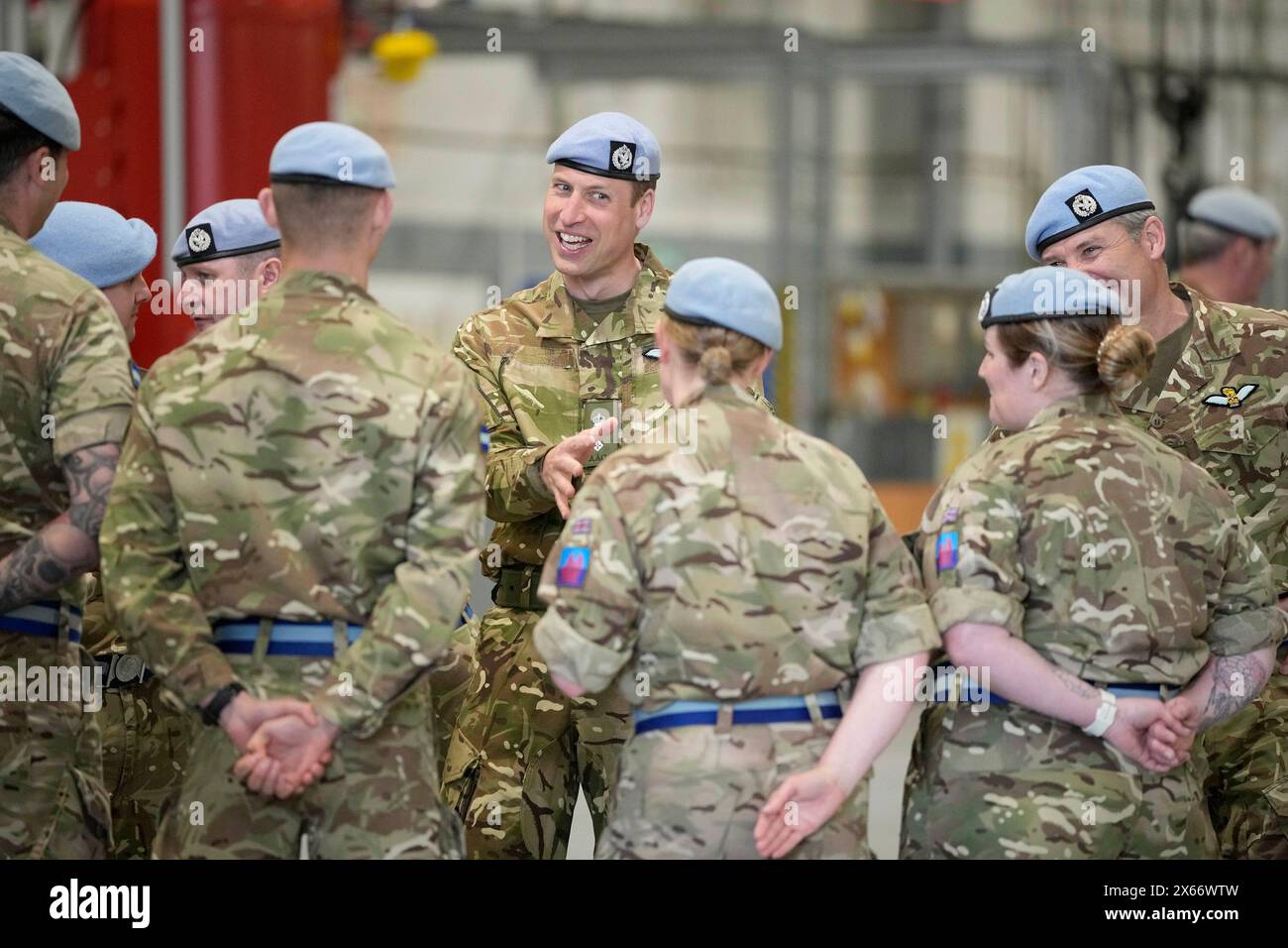 The Prince of Wales speaks with service personnel at the Army Aviation ...