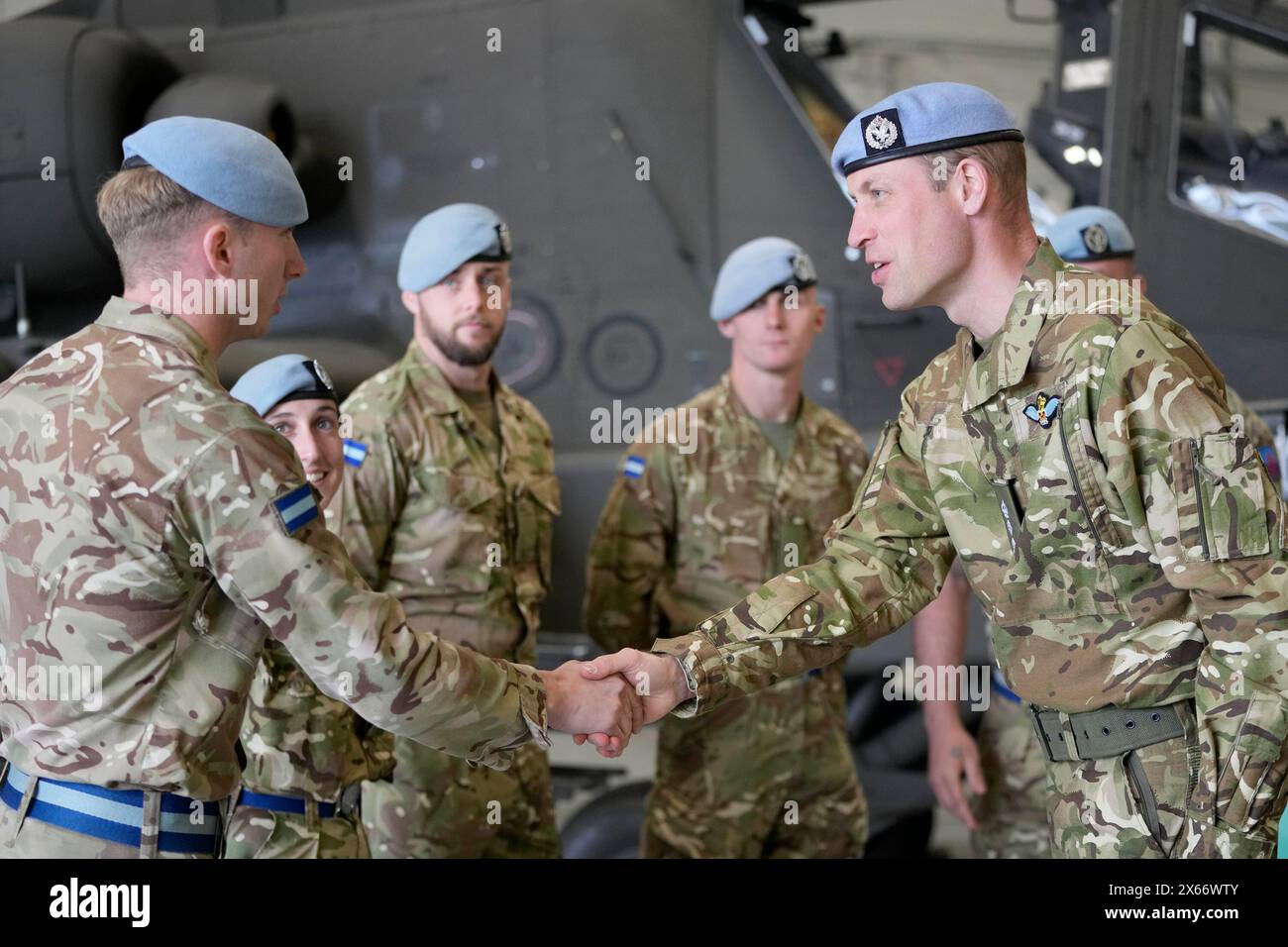 The Prince of Wales (right) speaks with service personnel at the Army ...