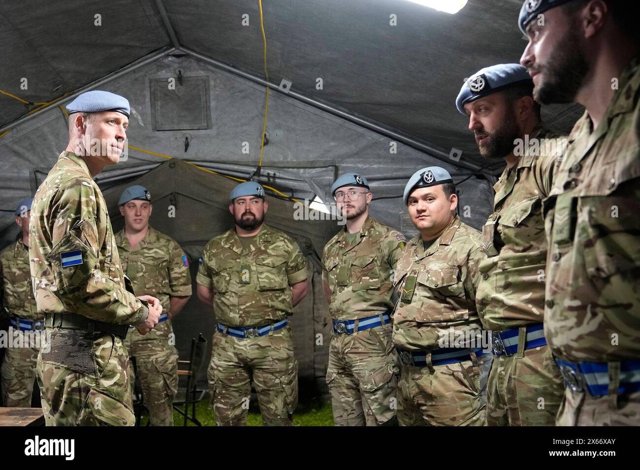 The Prince of Wales (left) speaks with service personnel at the Army ...