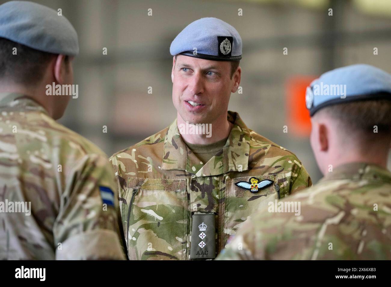 The Prince of Wales speaks with service personnel at the Army Aviation ...