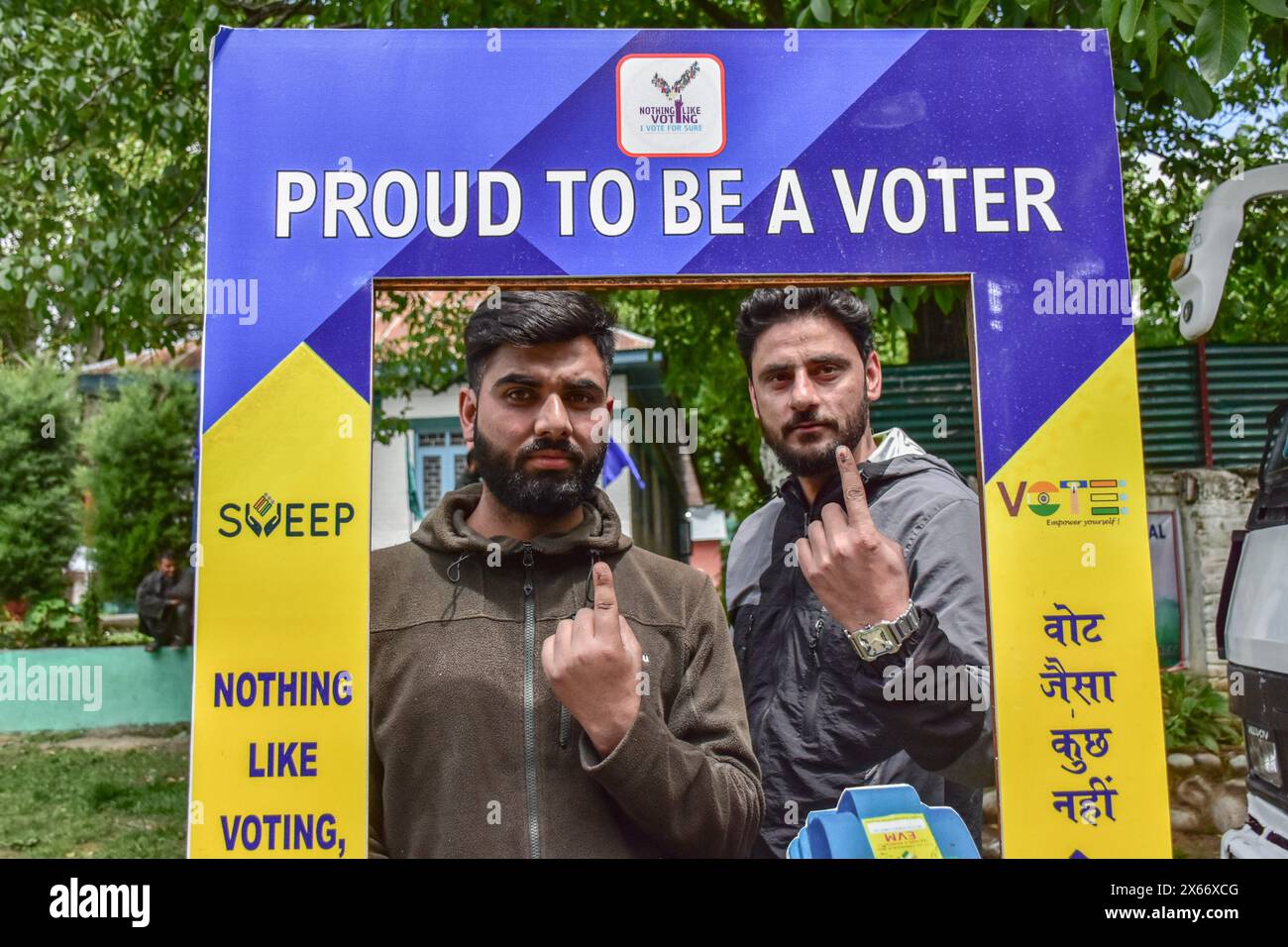 Kashmir, India. 13th May, 2024. Kashmiri men show their ink-stained ...