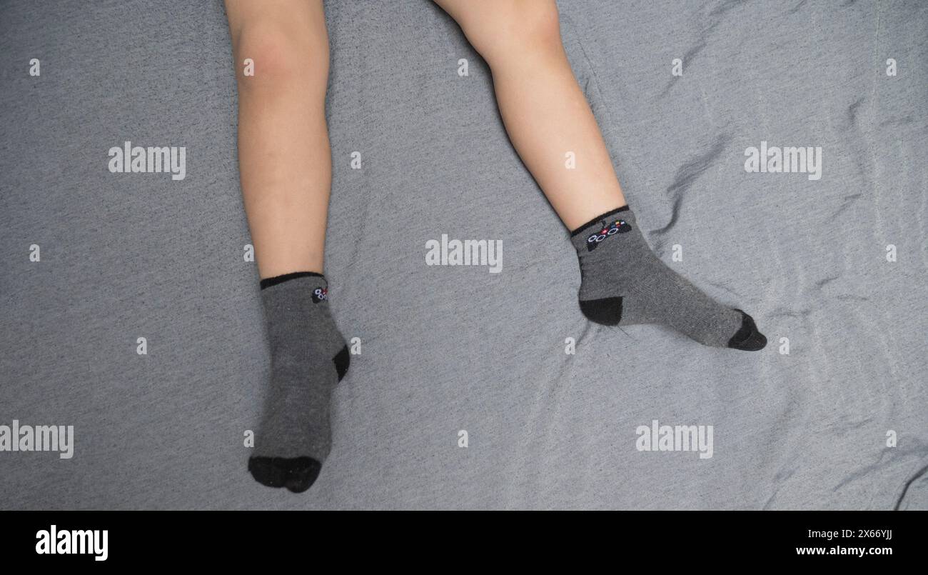 Children's feet in socks, Comfort and relaxation in the cold season ...