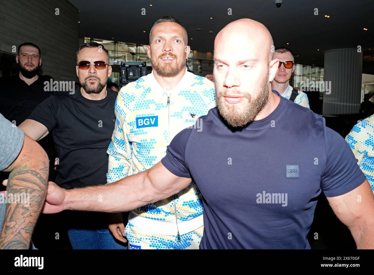 Boxer Oleksandr Usyk (centre left) arrives for a media day in Riyadh ...