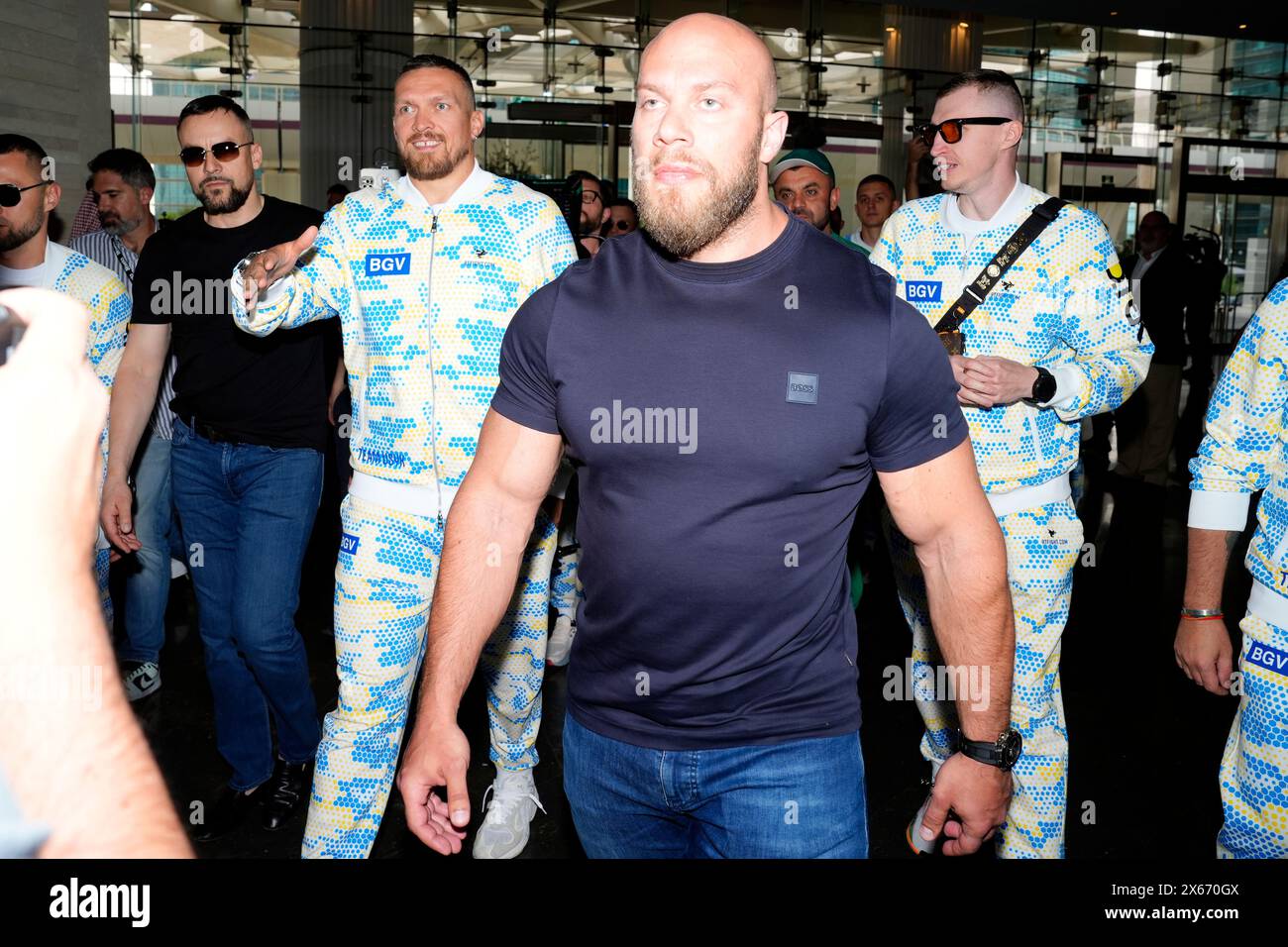 Boxer Oleksandr Usyk (second left) arrives for a media day in Riyadh ...