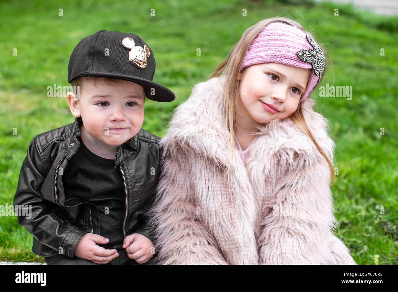 Cute little children playing together in blooming cherry garden Stock ...