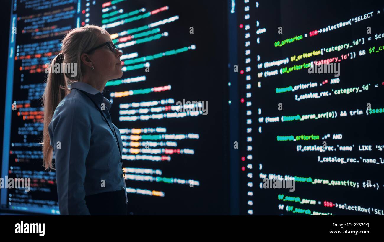 High-Tech Startup Concept: Innovative Female Software Engineer Standing and Doing Big Data ...