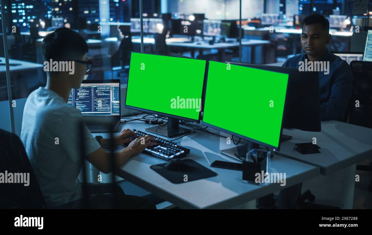 Night Office: Young Japanese Man in Working on Green Screen Chroma Key ...