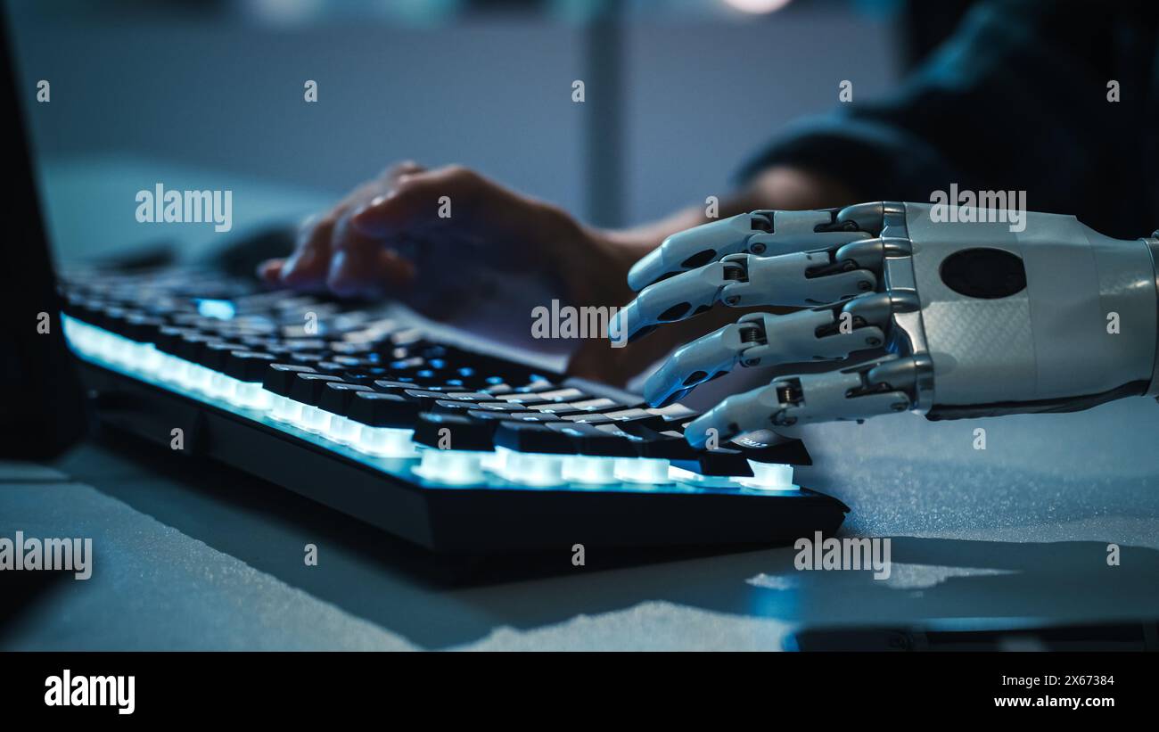 Close-up on Hands: Programmer With Disability Using Prosthetic Arm to ...