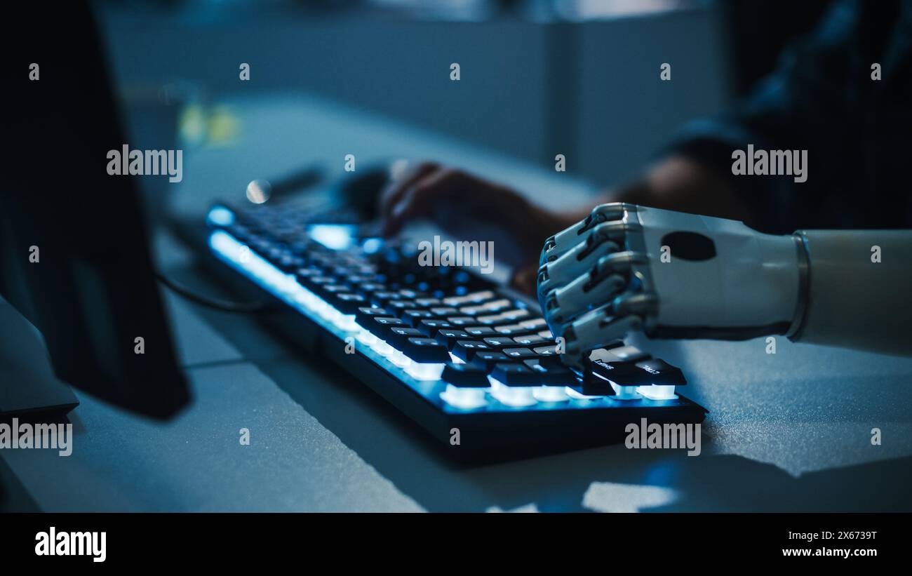 Close Up On Hands Programmer With Disability Using Prosthetic Arm To