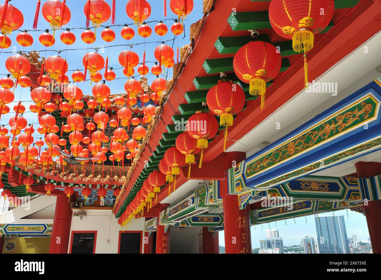 vibrant display of chinese red lanterns at a temple festival. a large ...