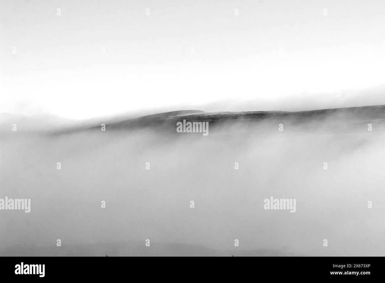 Mystical view of a mountain ridge emerging from the morning mist ...