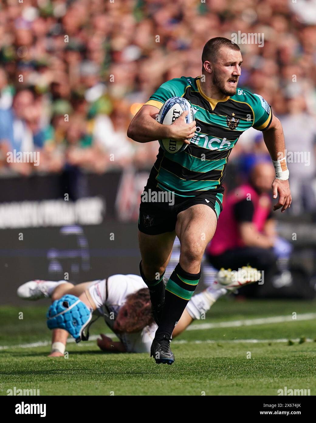 Northampton Saints' Ollie Sleightholme gets away from Gloucester's ...