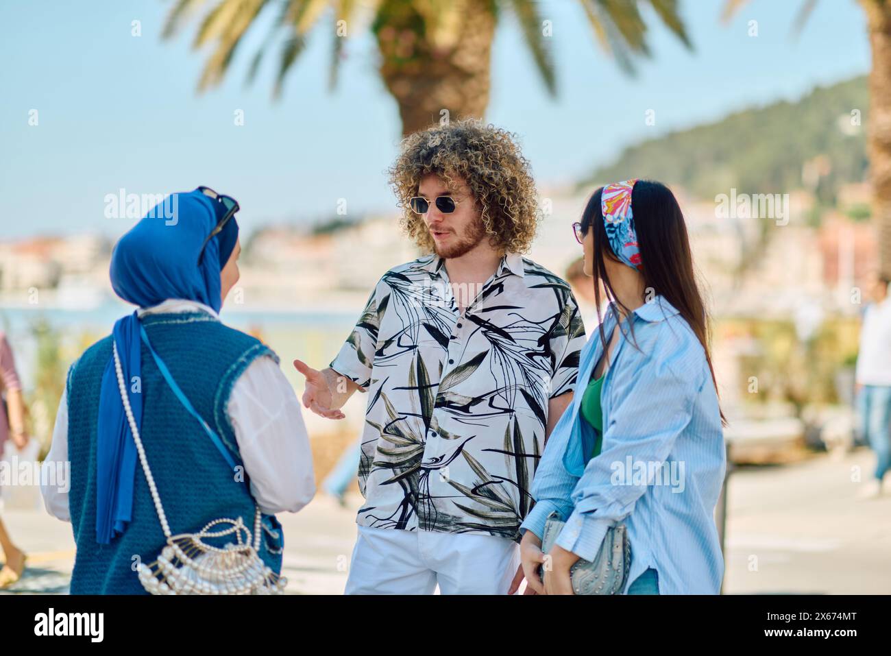 Coastal Conversations: Group of Tourists Planning Their Mediterranean ...