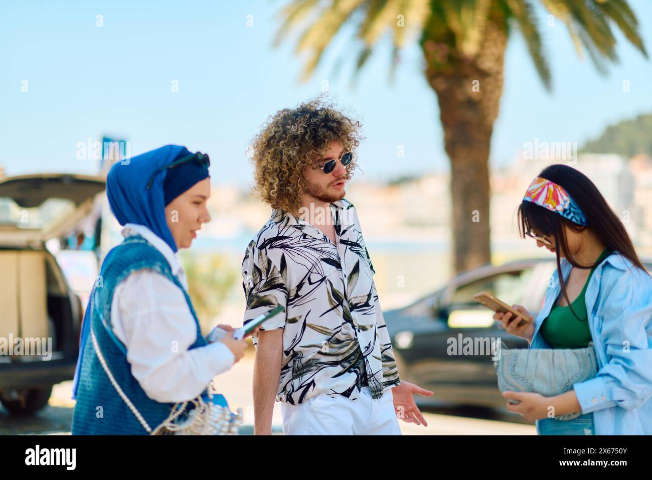 Coastal Conversations: Group of Tourists Planning Their Mediterranean ...