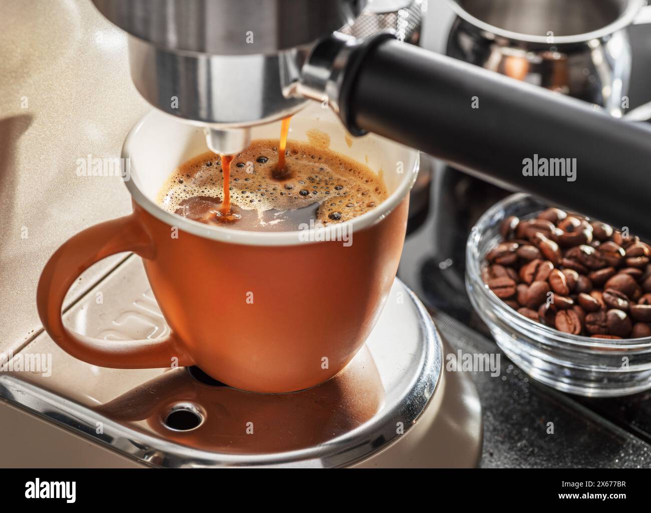 Automatic coffee machine. Pouring coffee into the coffee cup closeup ...