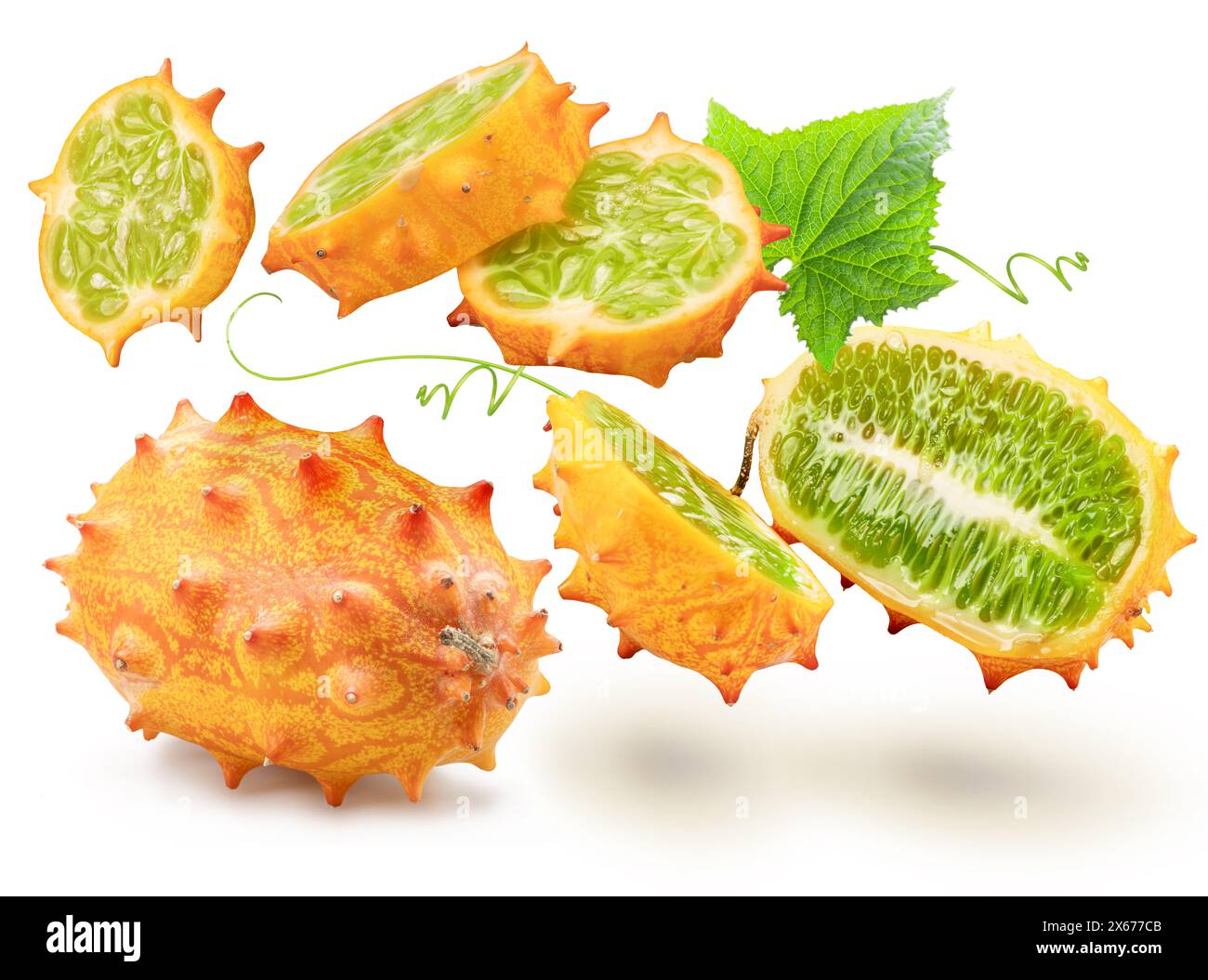 Kiwano fruit with kiwano slices levitating in air on white background Stock Photo - Alamy