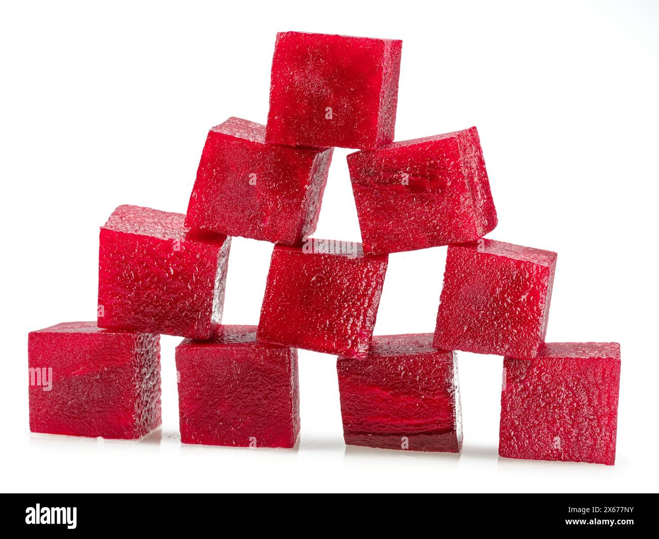 Raw red beetroot cubes arranged as pyramid isolated on white background ...