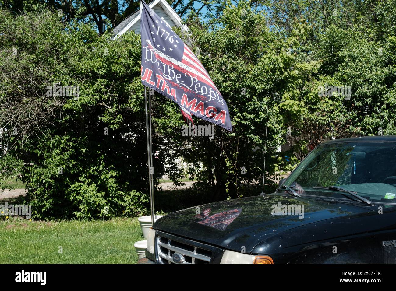 1776 We The People Ultra MAGA flag on display in a yard in Lum Michigan ...