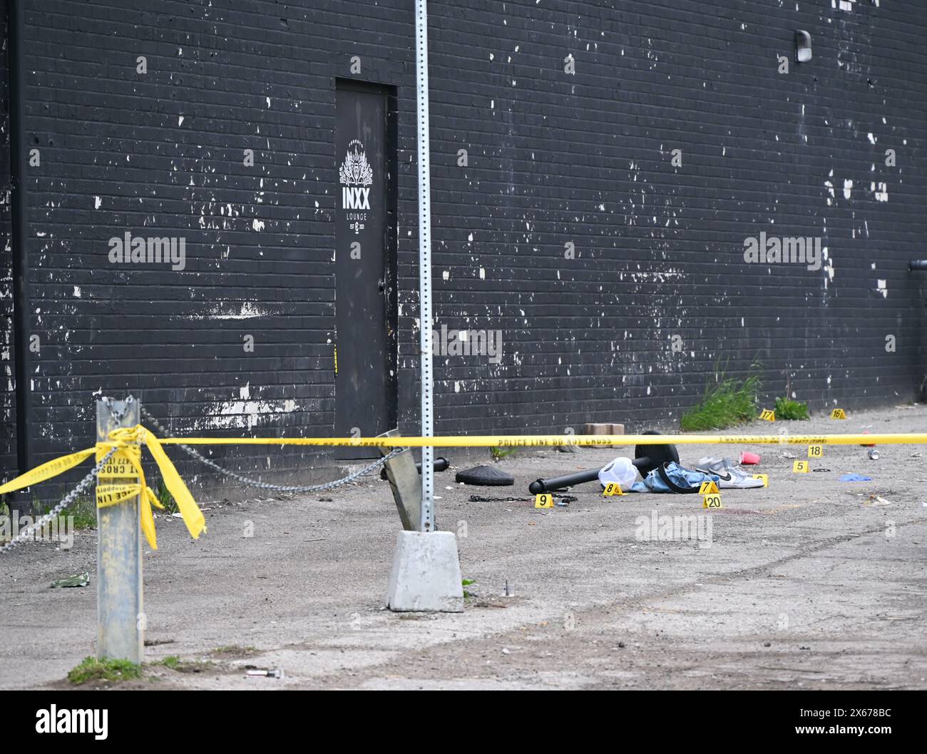 Evidence markers placed at the crime scene where clothes, shoes, shell ...