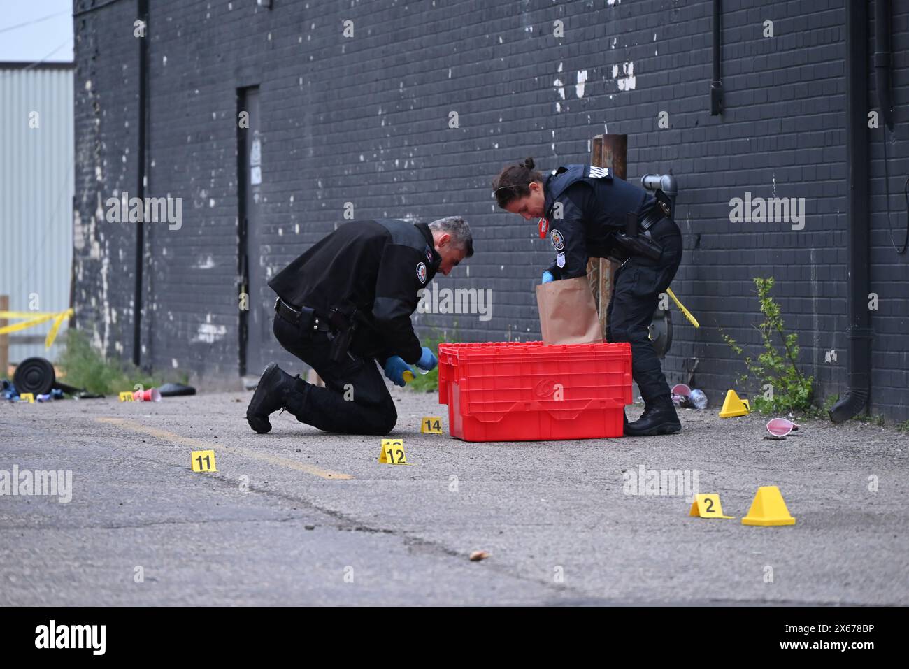 Evidence markers placed at the crime scene where clothes, shoes, shell ...