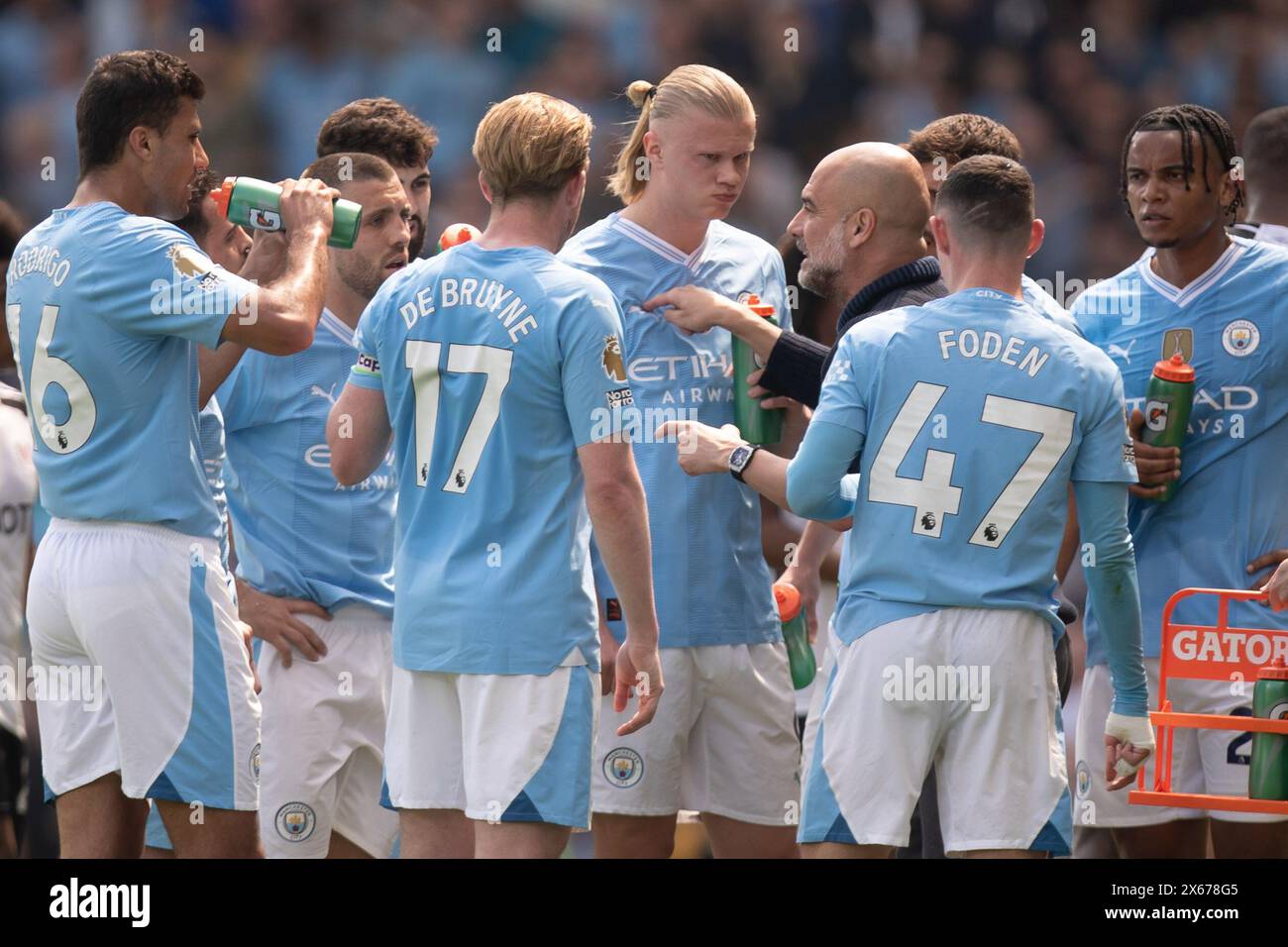 Pep Guardiola of Manchester City gives a team talk during the Premier ...