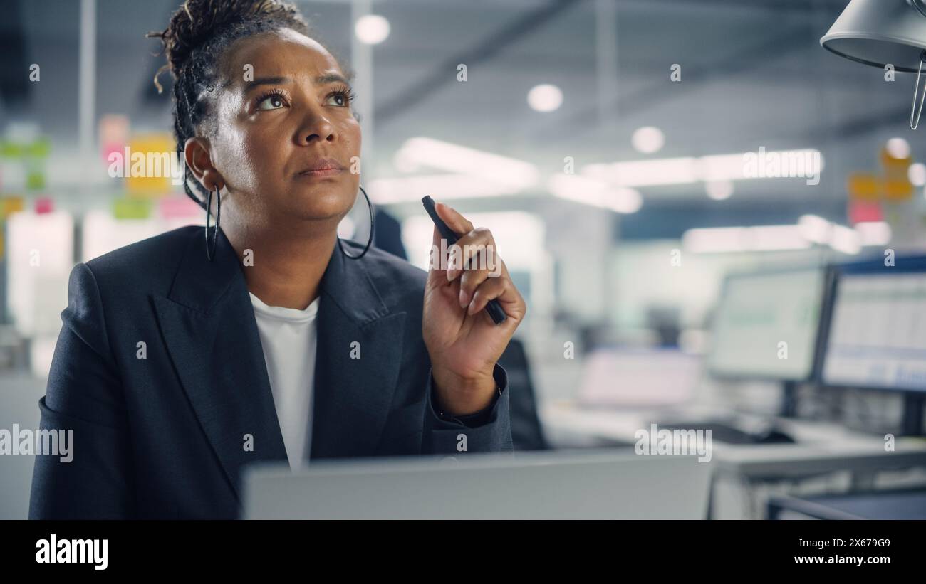 Busy African American Female Manager Using Computer in Modern Office ...