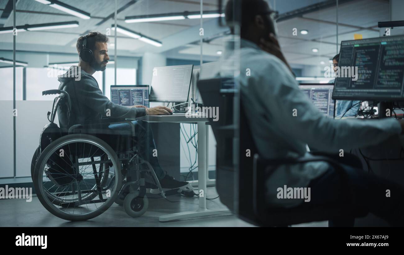 Disability-Friendly Office: Amazing IT Programmer with Disability in a Wheelchair Working on ...