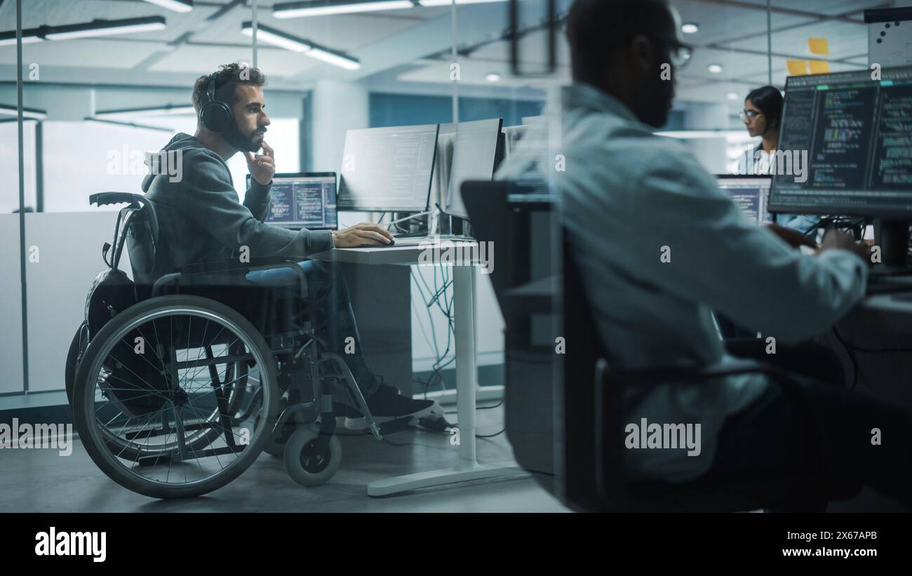 Disability-Friendly Office: Amazing IT Programmer with Disability in a Wheelchair Working on ...