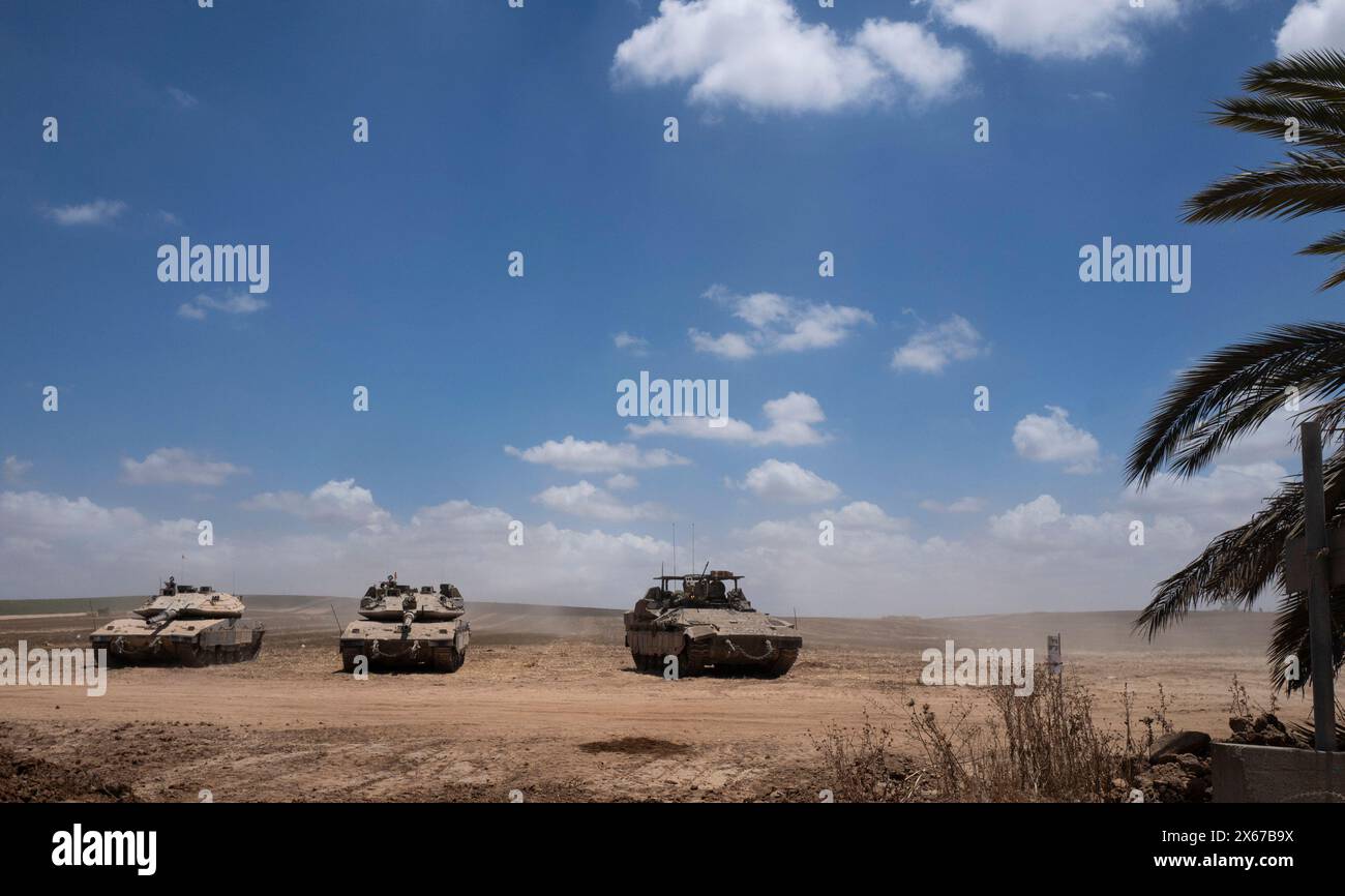 Southern Israel, Israel. 13th May, 2024. Israeli Merkava tanks and an ...