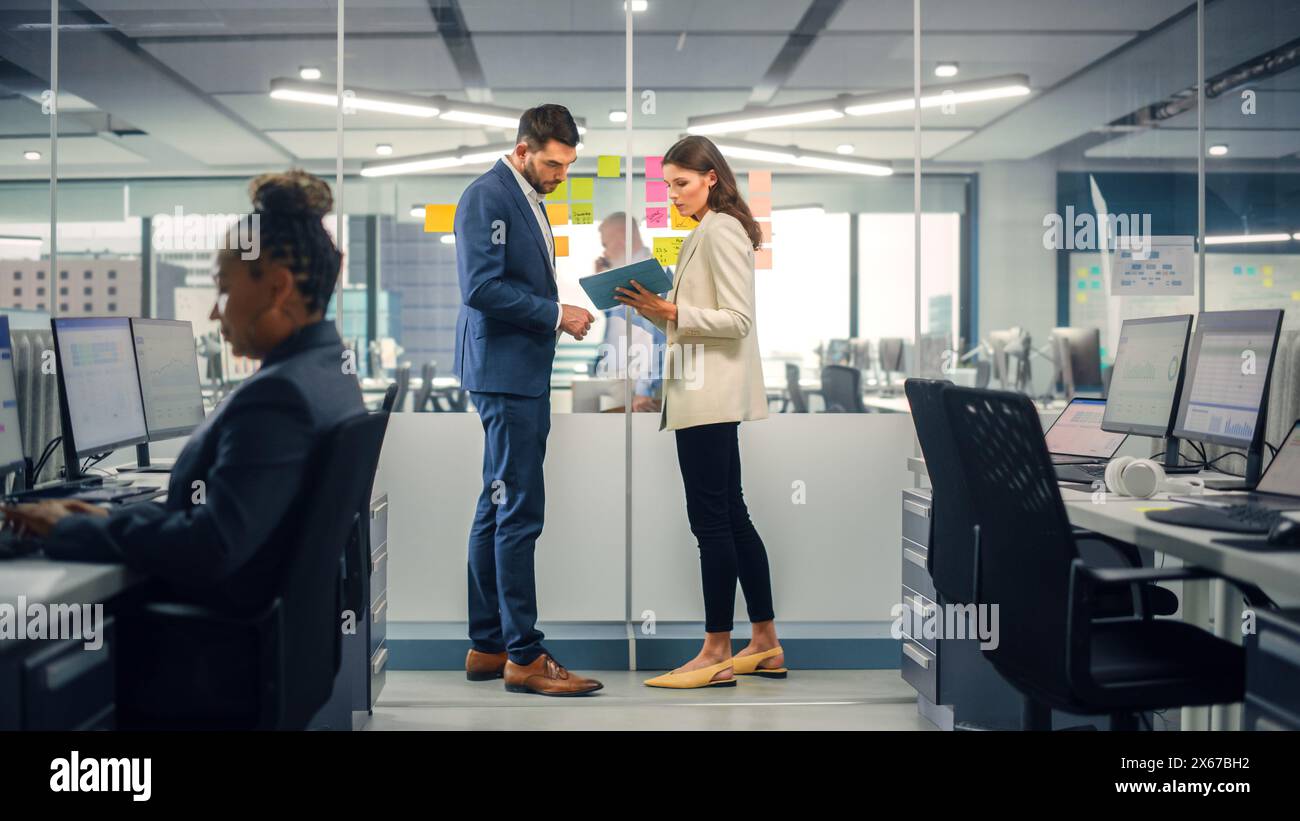 Young Manager Creating Project Plan with Experienced Colleague on ...