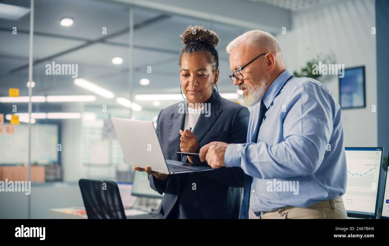 Senior Manager Talking to Experienced Confident Businessman while Using ...