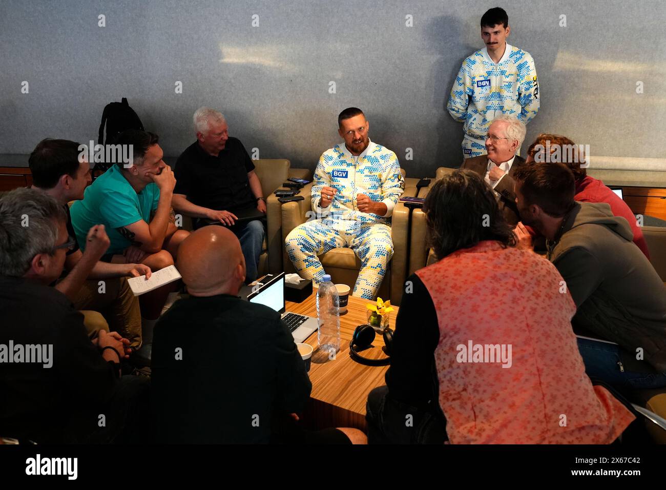 Boxer Oleksandr Usyk (centre) during a media day in Riyadh. The IBF ...